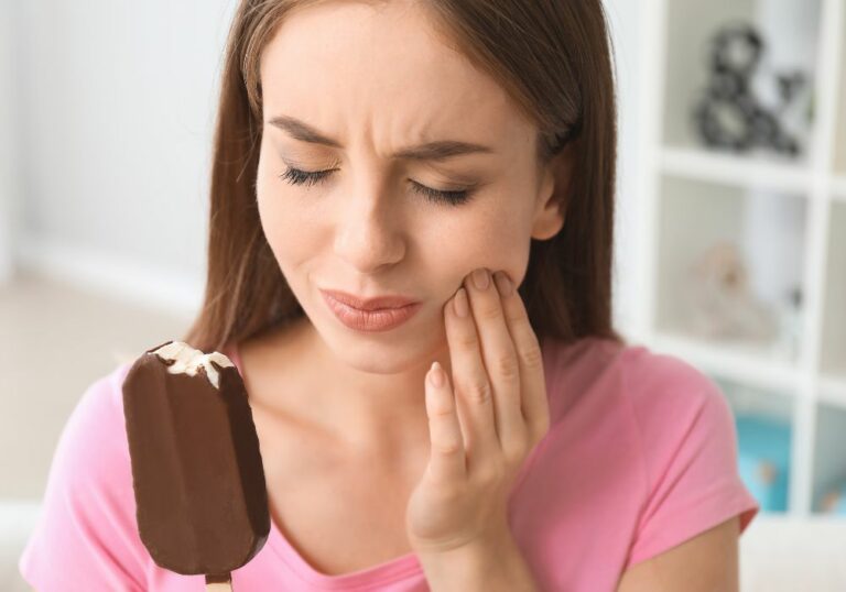 Why Does One Tooth Hurt When I Bite Down? (Causes & Treatments)