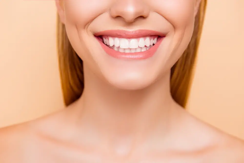 Why Are My Upper Front Teeth Bigger? (Causes & Treatment)